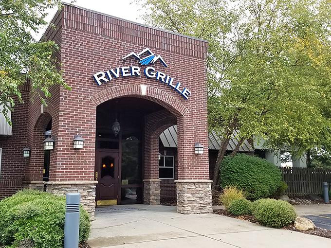 The brick fa&ccedil;ade of River Grille stands like a culinary fortress, promising treasures within that make the journey to Bentonville worthwhile.