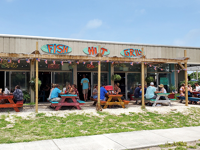 Fish Hut Grill&rsquo;s laid-back vibe is pure coastal bliss&mdash;picnic tables, fresh catch, and sunny smiles all around.