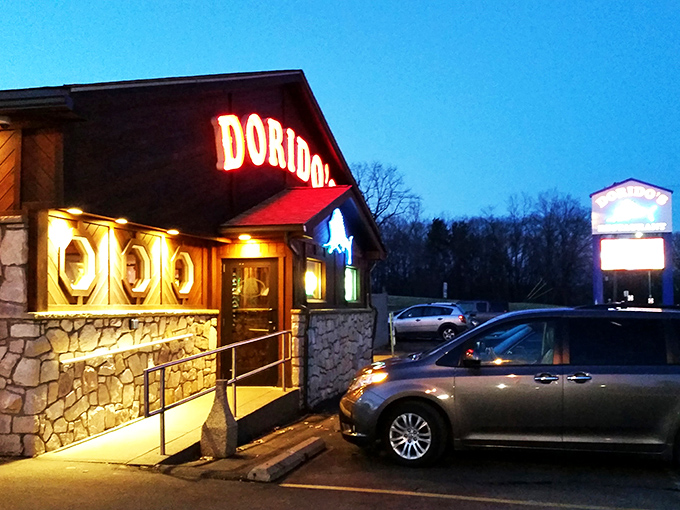 The glowing red Dorido's sign against rustic wood paneling promises seafood salvation in Pittsburgh's concrete jungle. Maritime magic awaits!
