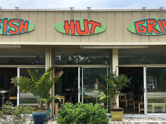 Fish Hut Grill&rsquo;s laid-back vibe is pure coastal bliss&mdash;picnic tables, fresh catch, and sunny smiles all around.
