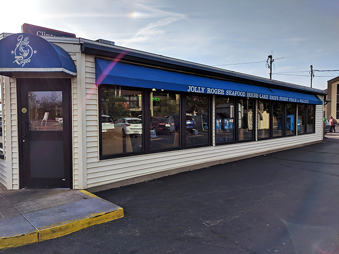 The unassuming exterior of Jolly Roger Seafood House&mdash;proof that the best treasures often hide behind the most modest facades. Lake Erie's culinary pirate ship awaits!