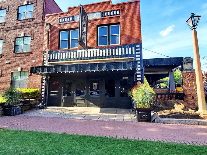 The iconic Deep Deuce Grill sign beckons hungry travelers like a lighthouse for comfort food. Those string lights aren't just decoration&mdash;they're a promise of good things to come.