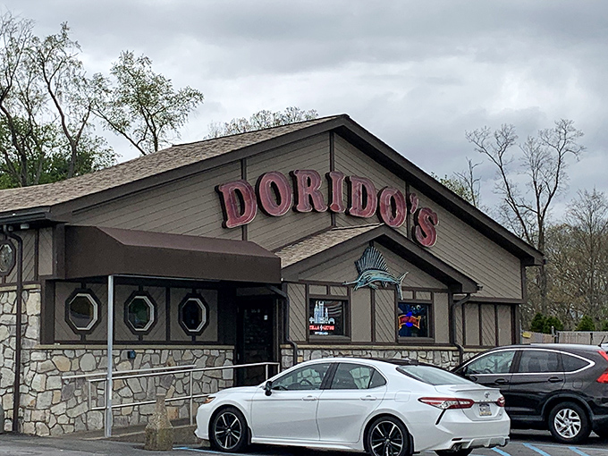 The glowing red Dorido's sign against rustic wood paneling promises seafood salvation in Pittsburgh's concrete jungle. Maritime magic awaits!