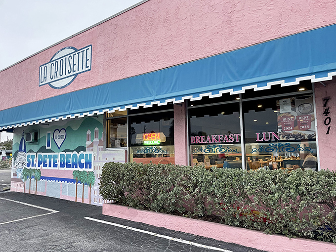 La Croisette's cheerful pink exterior with blue awnings stands out like a French postcard come to life on St. Pete Beach.