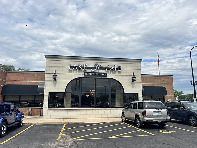 An unassuming strip mall storefront that proves culinary treasures don't always hide in fancy buildings. The American flag stands guard over breakfast paradise.