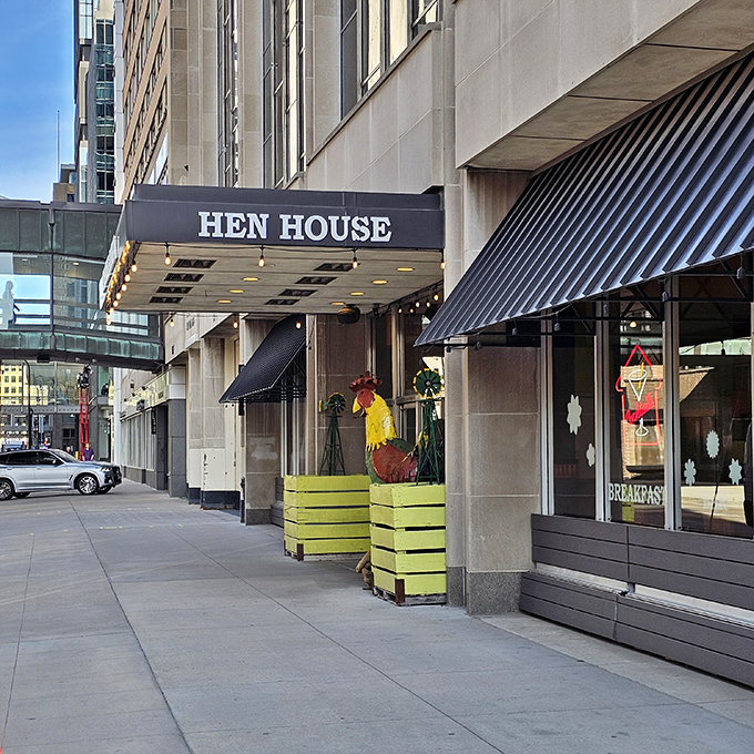 The blue awning of Hen House beckons like a breakfast lighthouse in downtown Minneapolis, promising morning salvation for hungry city dwellers.