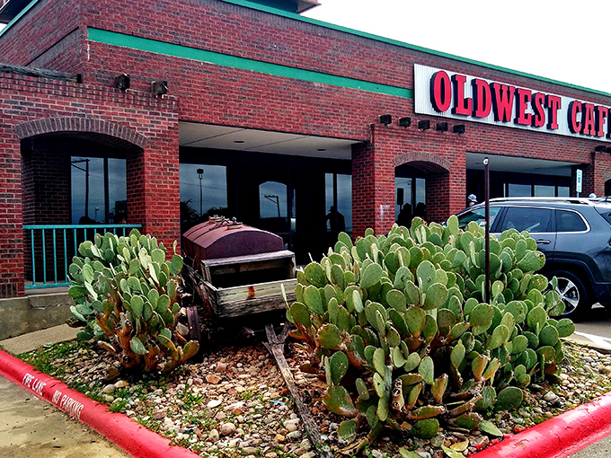 The bold red letters against corrugated metal announce Oldwest Cafe like a breakfast beacon. No fancy frills needed when what's inside speaks volumes.