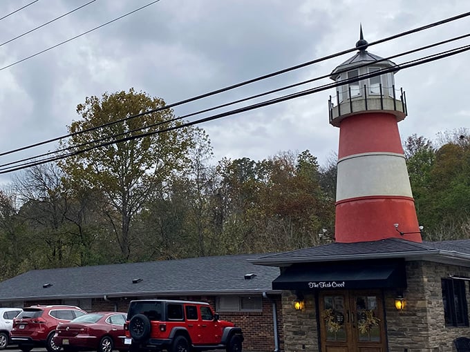 The lighthouse beckons! Fish Creel's iconic red and white tower stands as a quirky landmark, promising seafood treasures in landlocked northern Alabama.