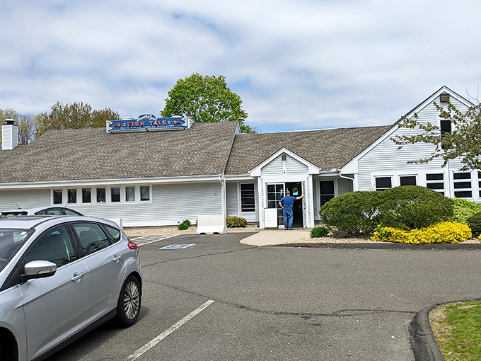 The unassuming exterior of seafood paradise – where Connecticut's coastal treasures await behind a humble façade that belies the culinary magic within.