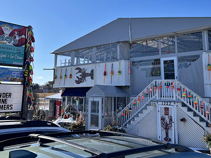 The stairway to seafood heaven! Petey's distinctive white exterior with colorful buoys promises maritime delights before you even step inside.