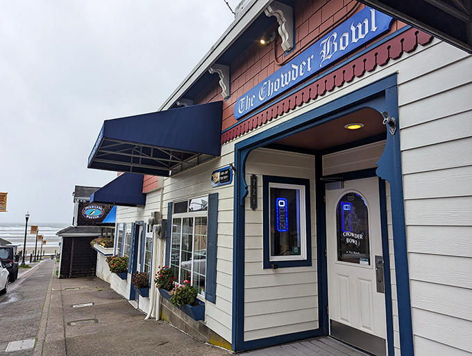 The classic coastal charm of The Chowder Bowl beckons like an old friend, its blue-trimmed facade promising seafood salvation after a long drive.
