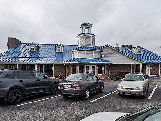 The distinctive blue roof and octagonal tower of Blue Ocean Seafood Restaurant stand as a beacon for hungry travelers seeking seafood salvation in Clinton.