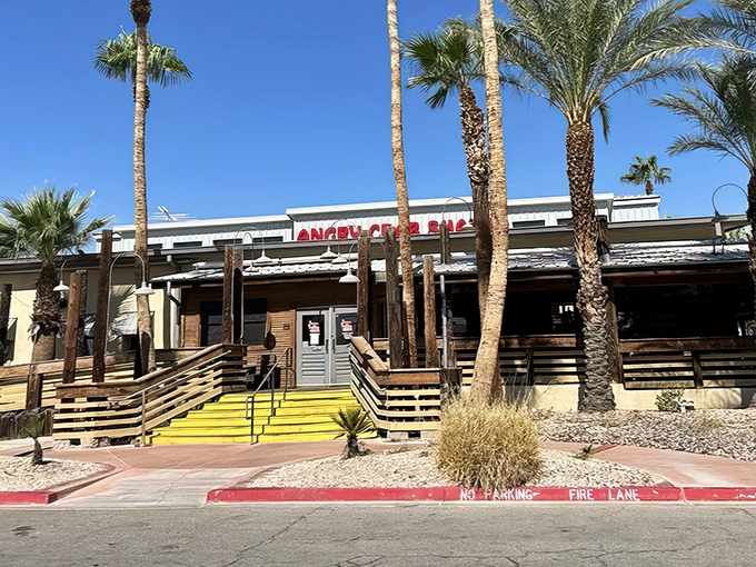 Palm trees and wooden ramps welcome you to seafood paradise&mdash;where the desert meets the ocean at Angry Crab Shack's inviting Henderson location.