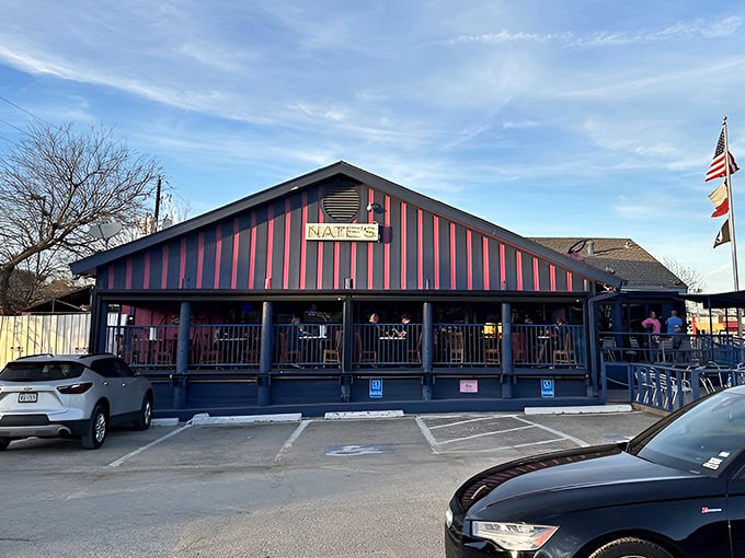 The pink-striped exterior of Nate's stands out like a flamingo in a penguin colony. Three flags flutter above this unassuming seafood sanctuary in Addison.