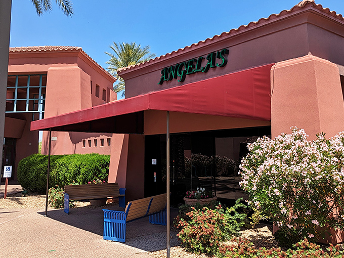 Angela's Kitchen welcomes you with its warm terracotta exterior and vibrant red awning&mdash;like a sunset-colored beacon for hungry souls in Surprise.