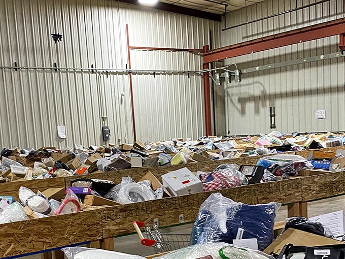 Treasure hunting paradise! Wooden bins stretch across the warehouse floor like archaeological sites waiting to be excavated by bargain-seeking adventurers.