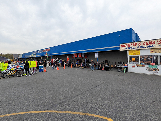 The blue facade of Plaza Flea Market beckons like a retail Narnia&mdash;where your wallet enters full and exits empty, but your heart does the opposite.