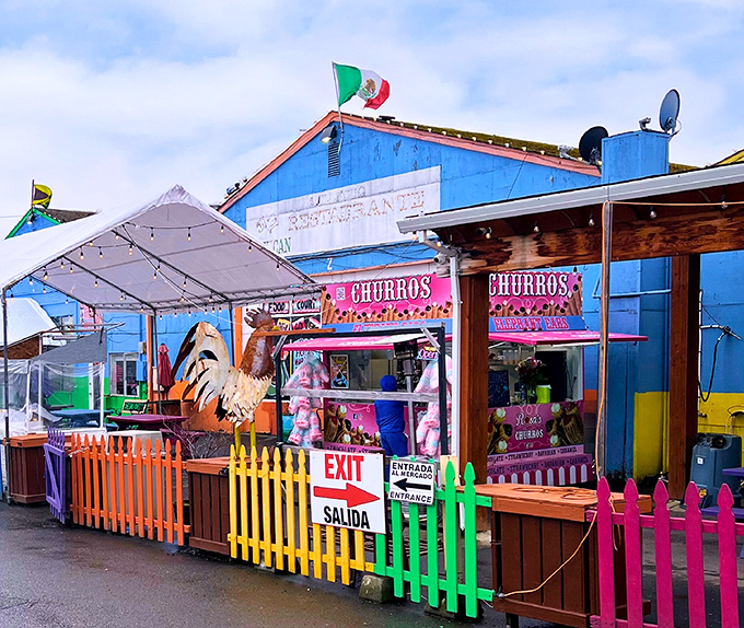 The churro stand alone is worth the trip! A vibrant Mexican flag waves proudly above this colorful outpost of deep-fried happiness.