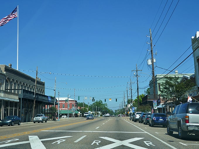 Paul's Caf&eacute; anchors the corner of Ponchatoula's historic downtown, where string lights create an everyday celebration atmosphere along brick-paved streets.