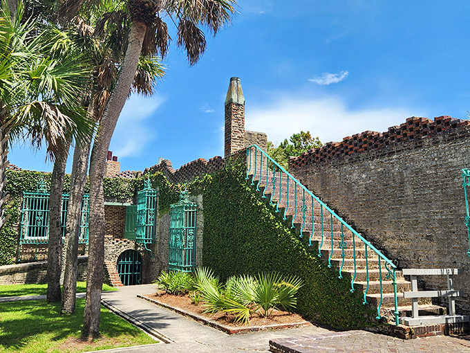 The vine-covered walls of Atalaya Castle create a striking contrast against South Carolina's blue skies, where Mediterranean dreams meet Palmetto State reality.