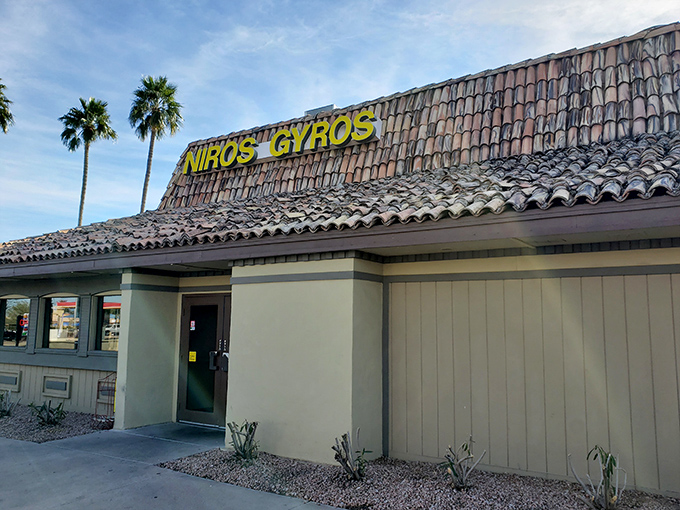The humble exterior of Niro's Gyros stands like a Mediterranean mirage in the Phoenix desert, complete with classic tile roof and swaying palm trees.