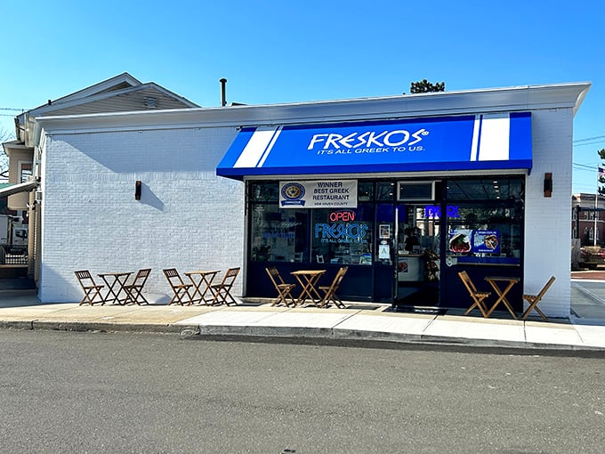 The iconic blue awning of Freskos stands out like a beacon of Mediterranean promise, complete with sunny outdoor seating for those perfect Connecticut afternoons.