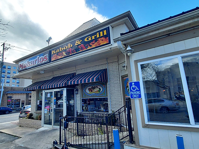 The Mediterranean promised land awaits! Makarios Kabob & Grill's inviting storefront in Birmingham beckons with its striped awnings and promise of authentic flavors.