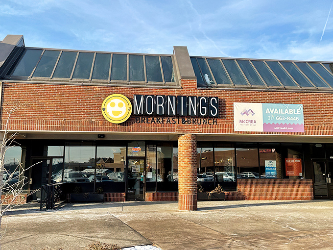 The cheerful yellow smiley face logo seems to know something you don't yet&mdash;that breakfast nirvana awaits behind those brick walls.