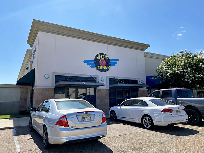 The unassuming exterior of Jo's Diner in Flowood hides a breakfast paradise within. That blue and white sign promises comfort food glory that delivers every time.