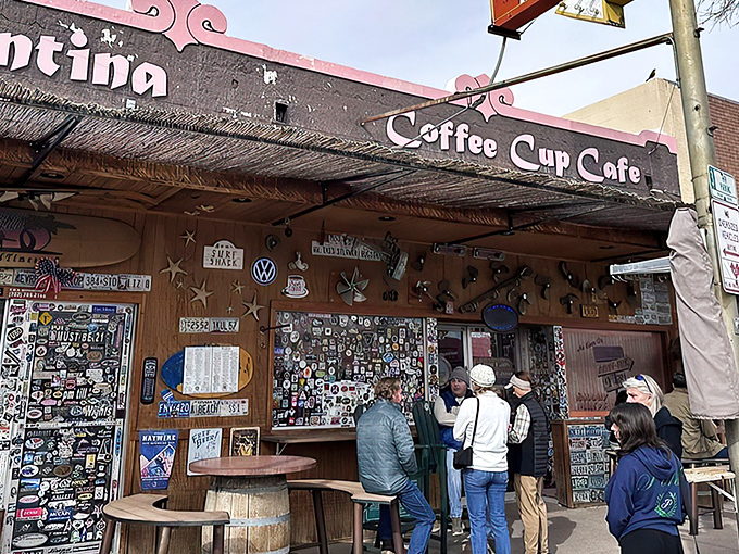 Sticker heaven meets breakfast paradise. The Coffee Cup Cafe's exterior is a visual feast of memorabilia that promises the culinary adventure waiting inside.