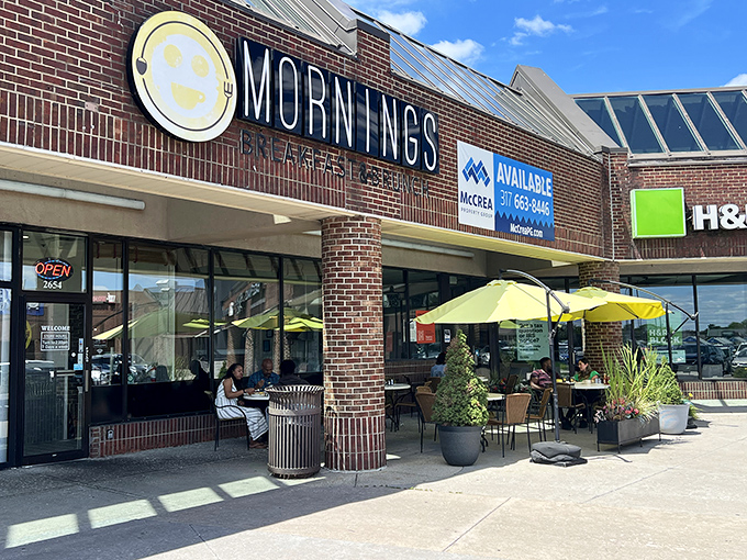 The cheerful yellow smiley face logo seems to know something you don't yet&mdash;that breakfast nirvana awaits behind those brick walls.