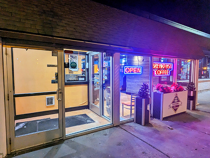 The neon promise of "BREAKFAST COFFEE" glows like a beacon for morning-starved souls. This unassuming storefront houses Minneapolis breakfast magic.