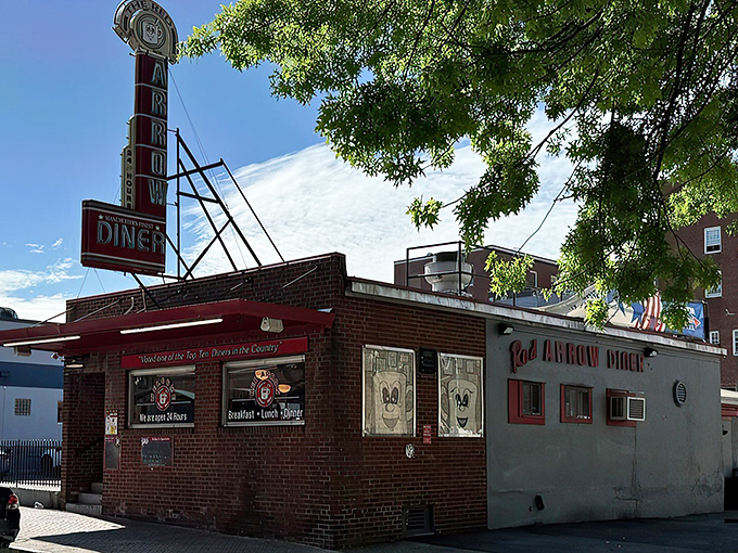 The iconic brick exterior of Red Arrow Diner proudly announces its status as a top-ten diner. Manchester's 24-hour beacon of breakfast bliss awaits hungry travelers.