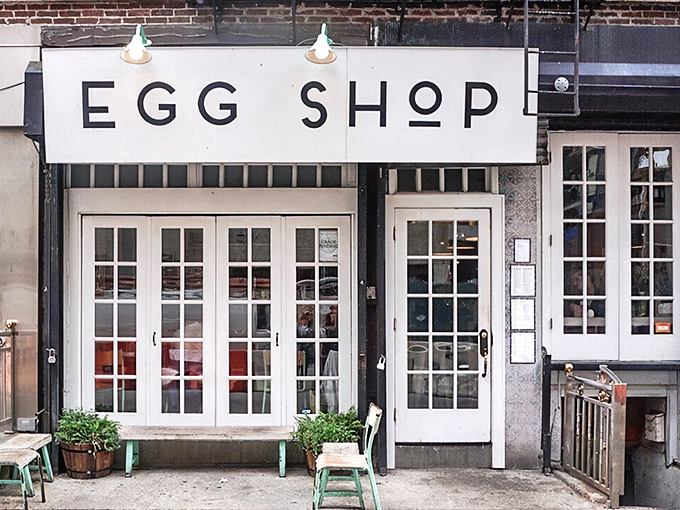 The minimalist white storefront of Egg Shop beckons like a breakfast beacon on Elizabeth Street, promising eggy delights within those French doors.