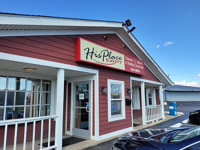 The unassuming red exterior hides culinary treasures like Superman's phone booth conceals his cape. Soul food salvation awaits inside.