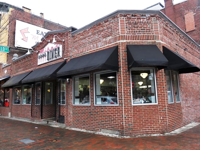 The brick fa&ccedil;ade of Mike's City Diner stands like a beacon of breakfast hope on Washington Street, promising culinary salvation to hungry Bostonians.