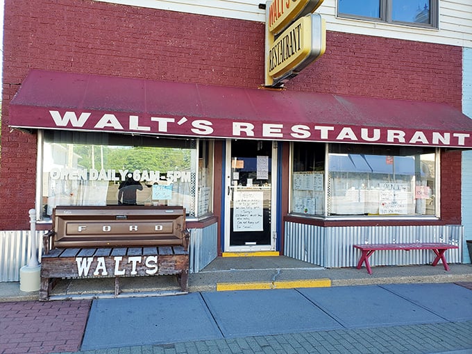 The unassuming yellow brick exterior of Walt's Restaurant stands as a beacon of breakfast hope on Caseville's main street, promising comfort food and local charm.