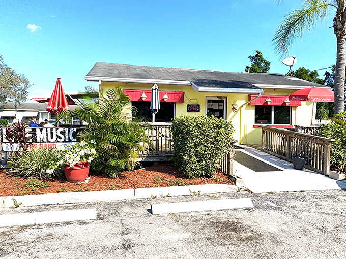 The cheerful yellow exterior with pink awnings isn't just inviting—it's practically shouting "breakfast is served!" Palm trees and a wooden deck complete this slice of Florida comfort.