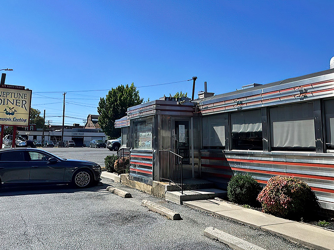 Neptune Diner's gleaming stainless steel exterior with classic red trim isn't just nostalgic&mdash;it's a time machine disguised as a restaurant. Comfort awaits inside. 