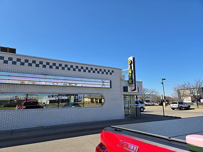 The classic black and white checkered exterior of Jimmie's Diner promises "BREAKFAST ALL DAY" &ndash; words that warm the soul like a hug from grandma.