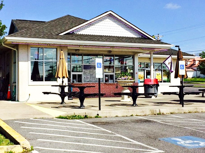 Sunny afternoons are perfect for grabbing a cold treat at this charming walk-up stand featuring outdoor seating and classic vibes.