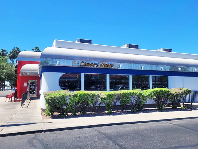 The red and white facade of Chase's Diner shines like a beacon against the Arizona sky, promising comfort food salvation to hungry travelers.