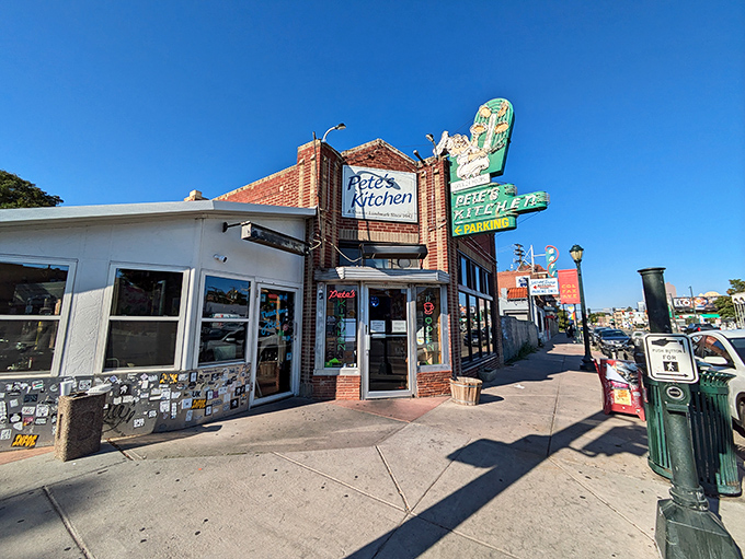 The neon glow of Pete's Kitchen at dusk isn't just a sign&mdash;it's a beacon of hope for hungry souls wandering Colfax Avenue.