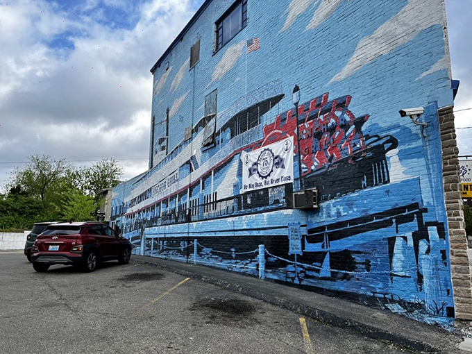The blue-painted exterior of Anchor Grill features a stunning steamboat mural that's like a maritime welcome committee for hungry travelers.