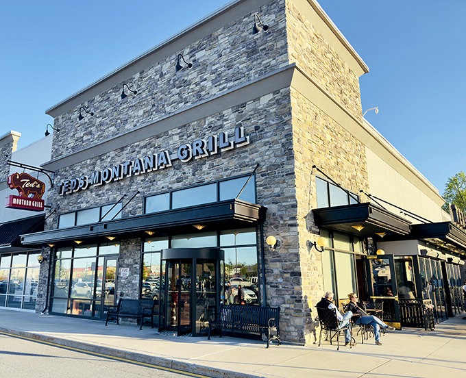 Ted's Montana Grill stands like a Western outpost in Newark, its stone facade and warm glow promising carnivorous delights within. The bison logo isn't just decoration&mdash;it's a promise.