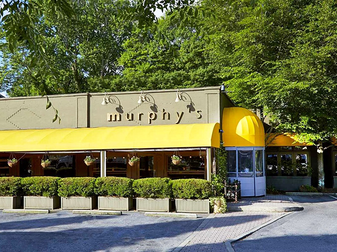 Murphy's signature yellow awning stands like a beacon of culinary delight in Atlanta's Virginia-Highland neighborhood, promising comfort and indulgence just beyond those doors.