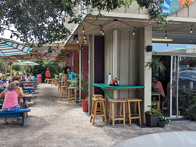 Fish Hut Grill&rsquo;s laid-back vibe is pure coastal bliss&mdash;picnic tables, fresh catch, and sunny smiles all around.