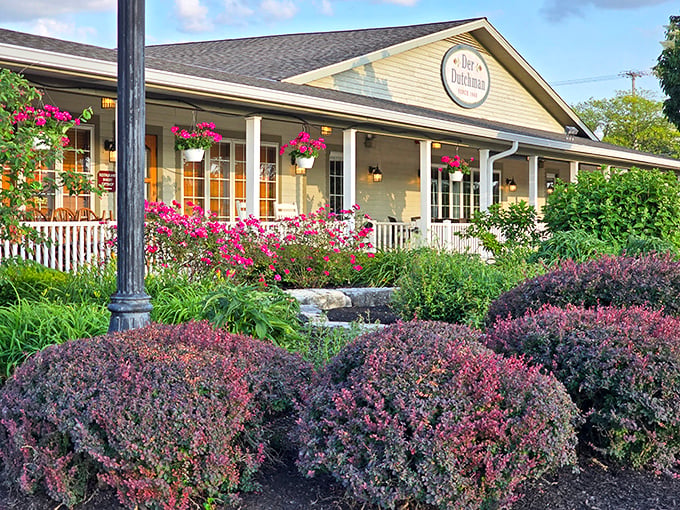 Der Dutchman's welcoming facade stands like a beacon of buttery hope along US-42, where both sedans and horse-drawn buggies find common parking ground.