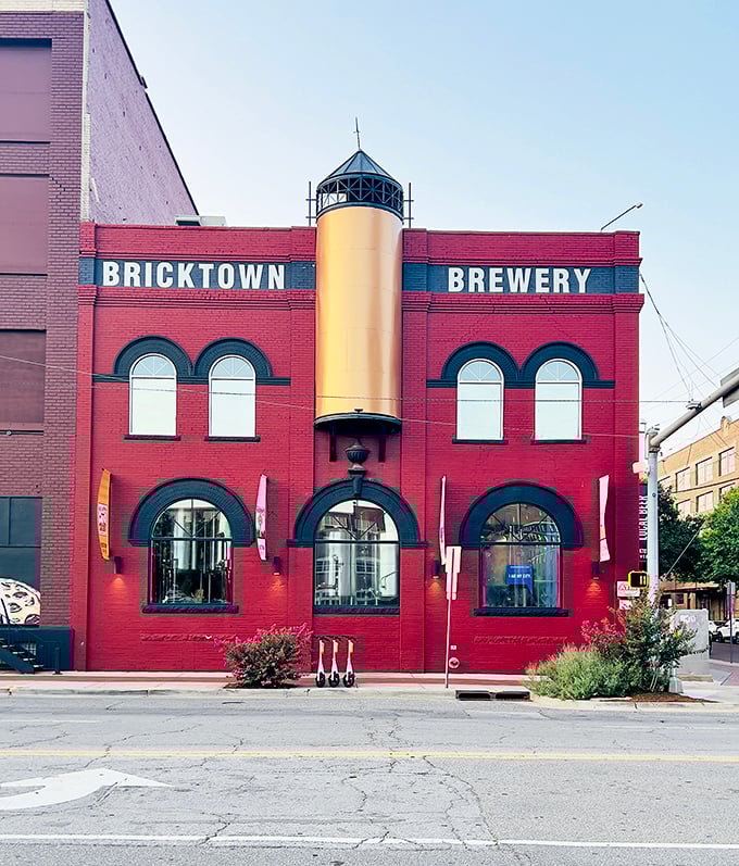 The iconic red brick exterior of Bricktown Brewery stands as a beacon of culinary promise in Oklahoma City's historic district, where industrial charm meets modern appetite.