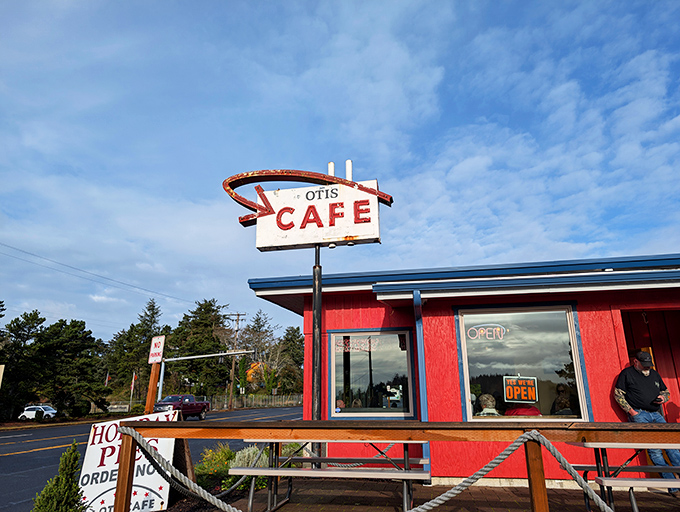 The iconic red exterior of Otis Caf&eacute; stands like a beacon for hungry travelers on Highway 18, promising comfort food salvation just minutes from the Oregon coast. 